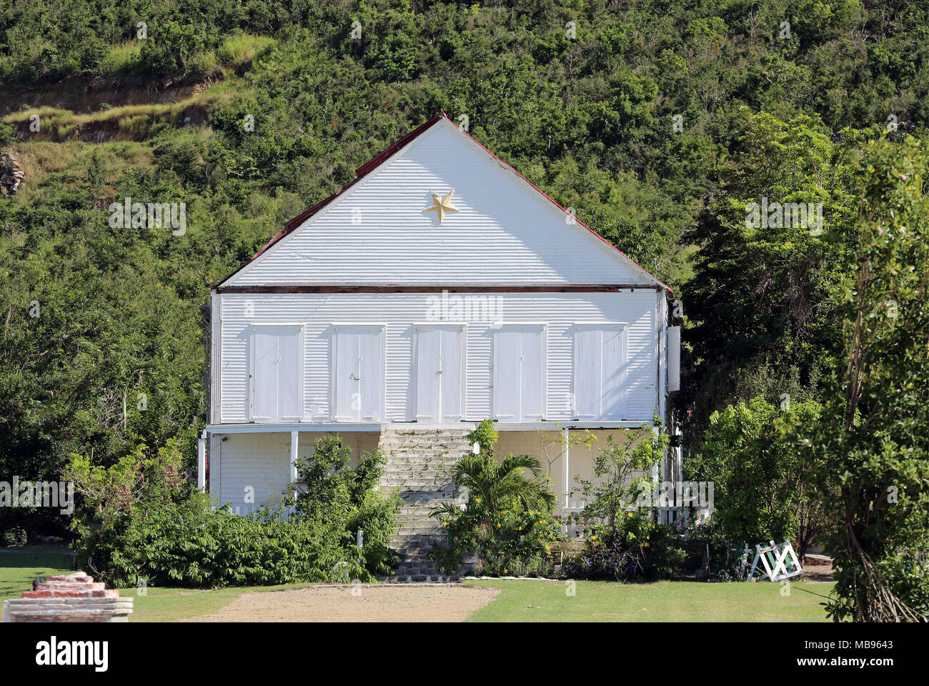 Traditional Caribbean style white wooden louvered window house Stock ...