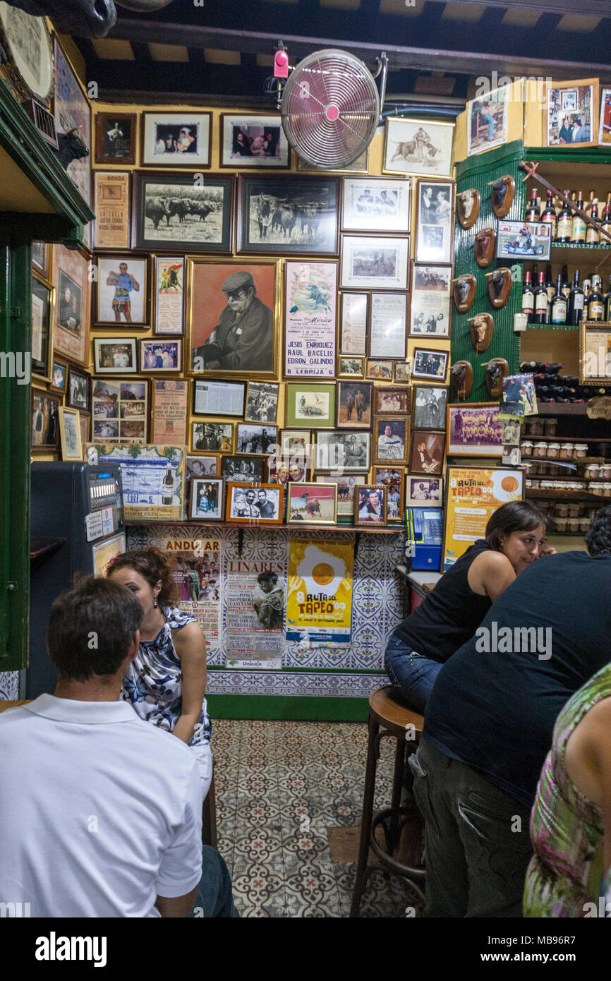 People inside Casa Manteca, traditional bar in Cadiz, Andalusia, Spain ...