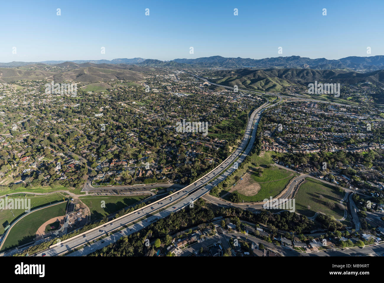 Aerial view of route 23 freeway, homes and parks in suburban Thousand ...