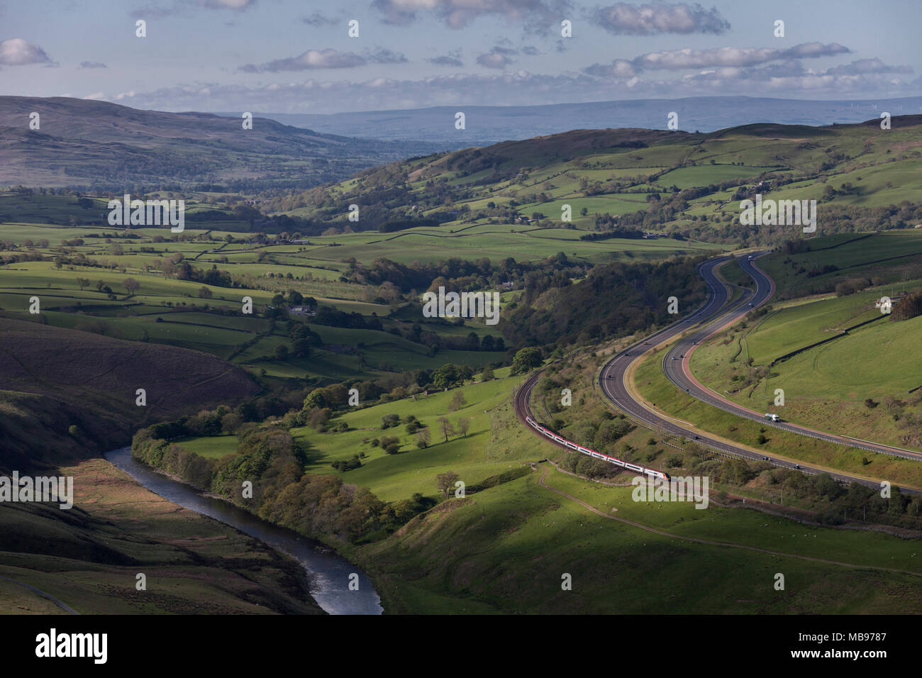 A Virgin Trains Pendolino train on the West Coast main line in the Lune ...