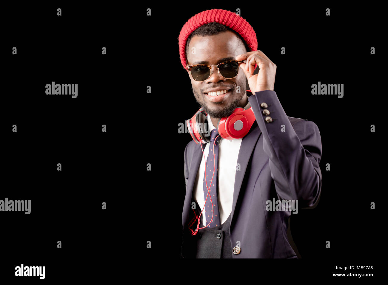 singer with beard wearing stylish outfit in sunglasses, red headphones ...
