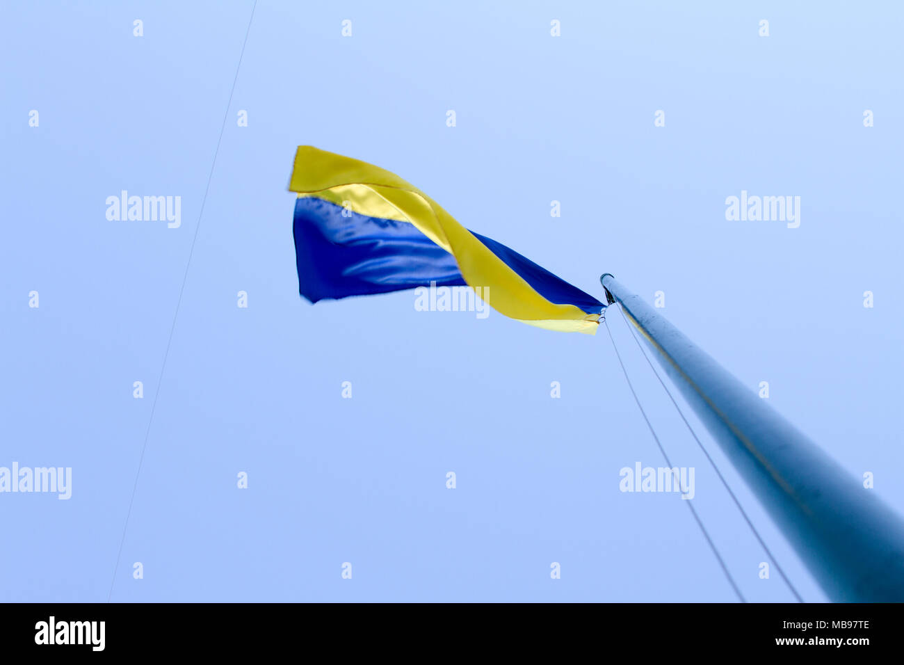 Colorful multicolored inflatable balls fly in air against background of ...