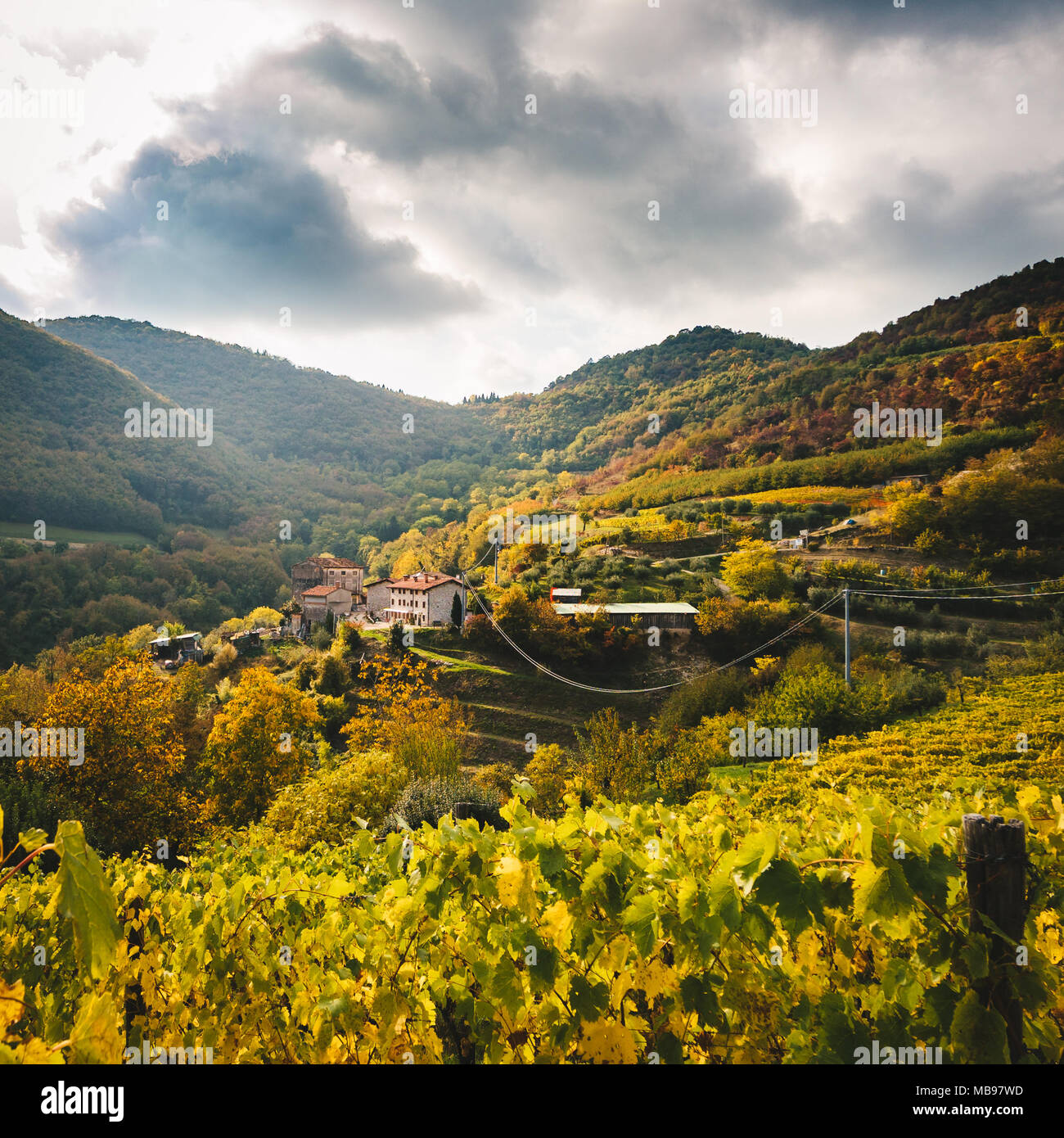 Very small village among the green Italian hills Stock Photo - Alamy