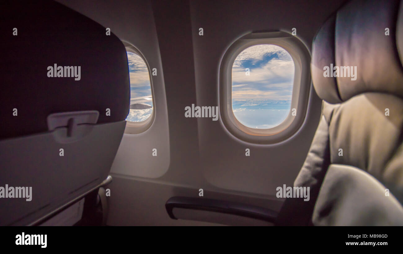 Airplane seat and window inside an aircraft Stock Photo - Alamy