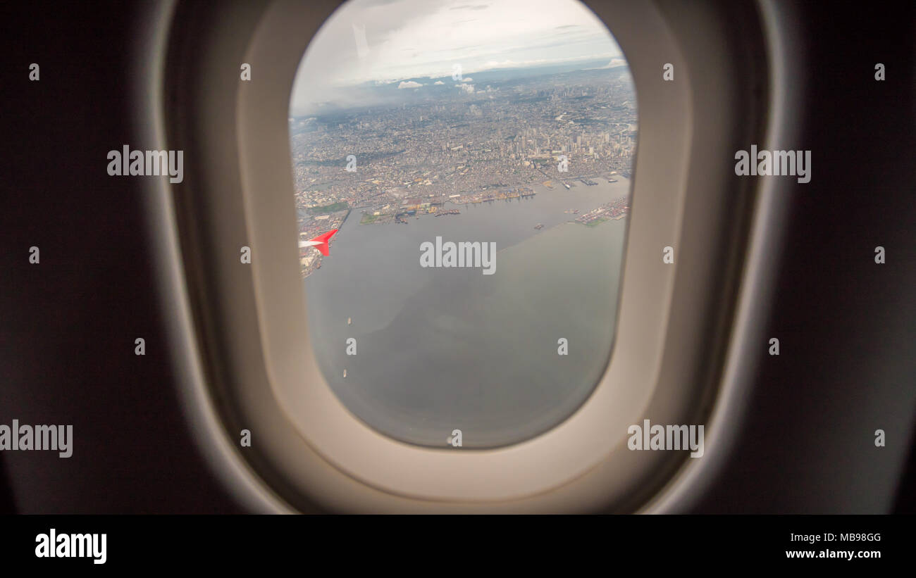 View from the window of the plane to the city of Manila. Philippines ...