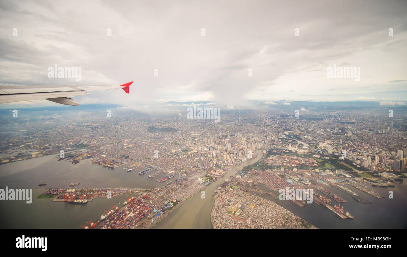 View from the window of the plane to the city of Manila. Philippines ...
