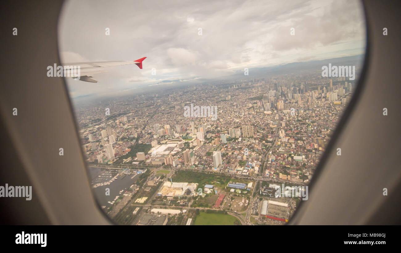 View from the window of the plane to the city of Manila. Philippines ...