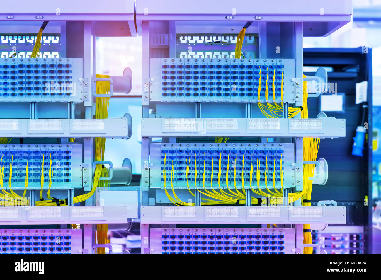 fiber optic telecommunication equipment and patchcords inside a network ...