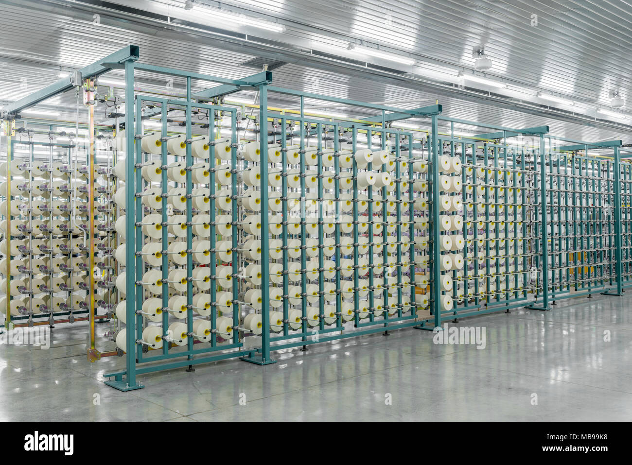 textile yarn on the warping machine. machinery and equipment in a ...