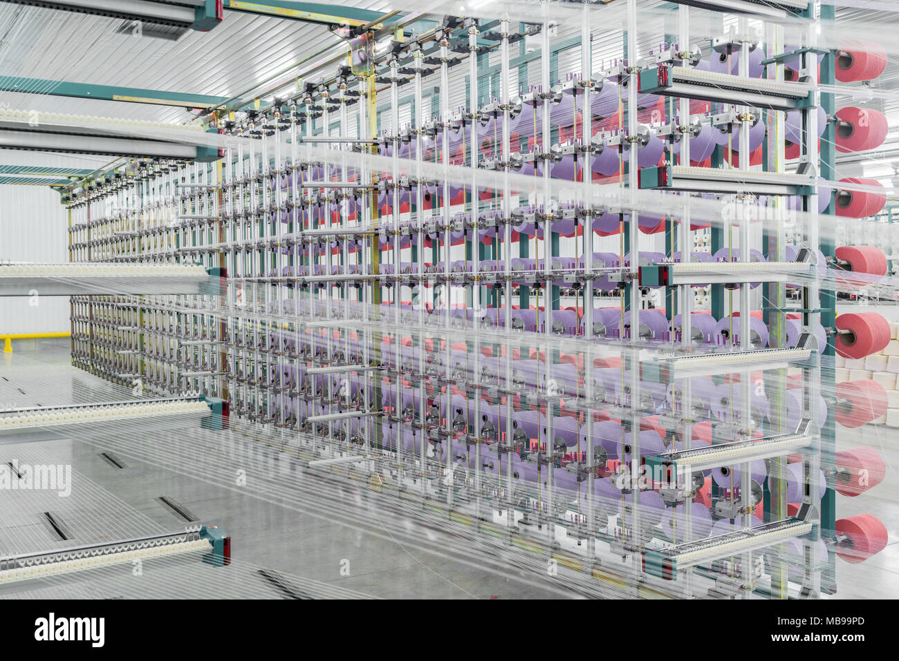 textile yarn on the warping machine. machinery and equipment in a ...