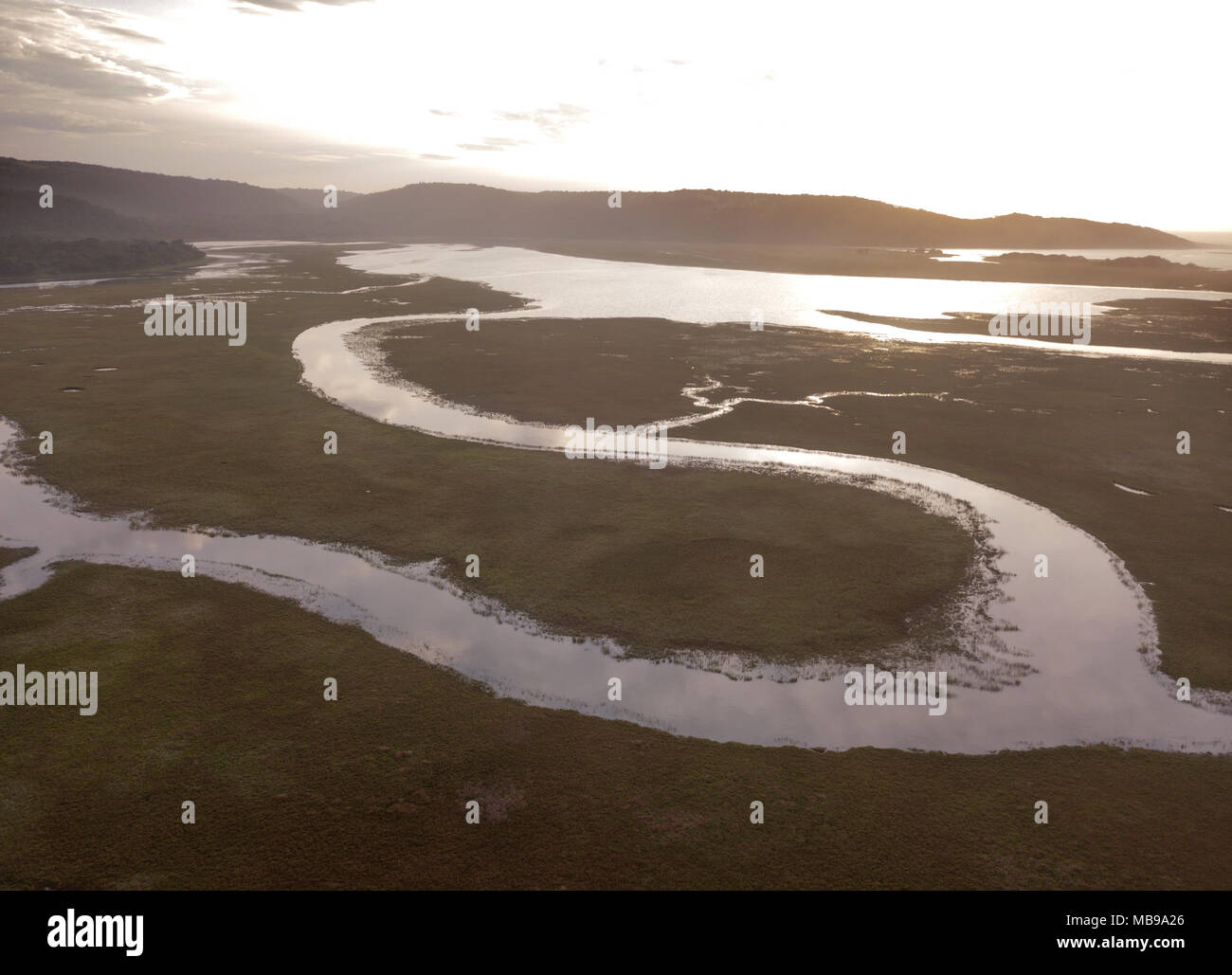 Aerial above a winding river in a wetland at sunrise Stock Photo - Alamy