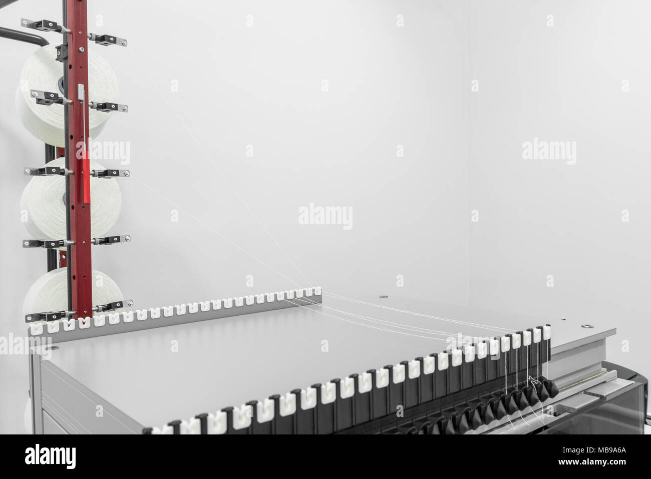 laboratory equipment checks the quality of cotton thread in a textile ...