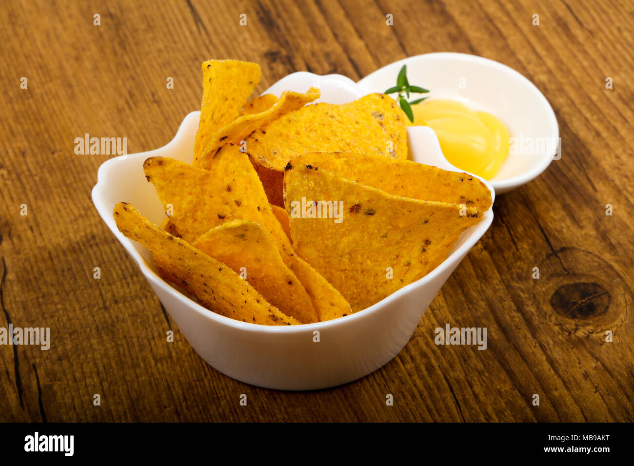 Nachos with cheese sauce Stock Photo - Alamy