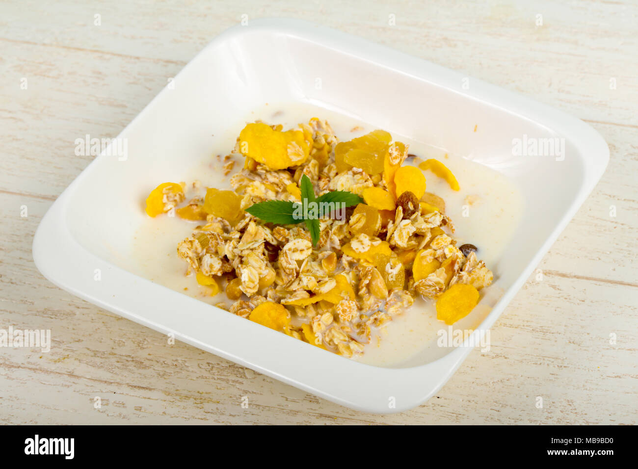Muesli with banana, nuts and mint Stock Photo - Alamy