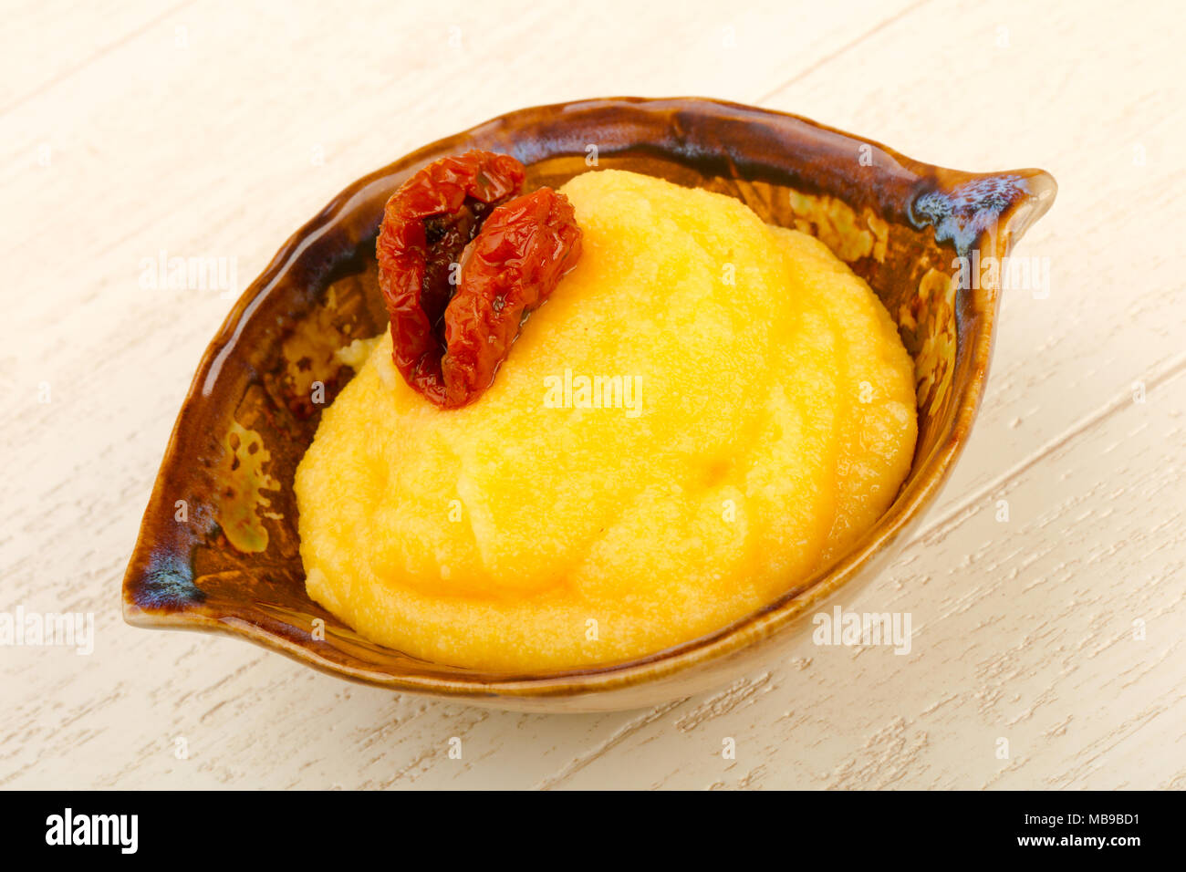 Polenta with dry tomato Stock Photo - Alamy