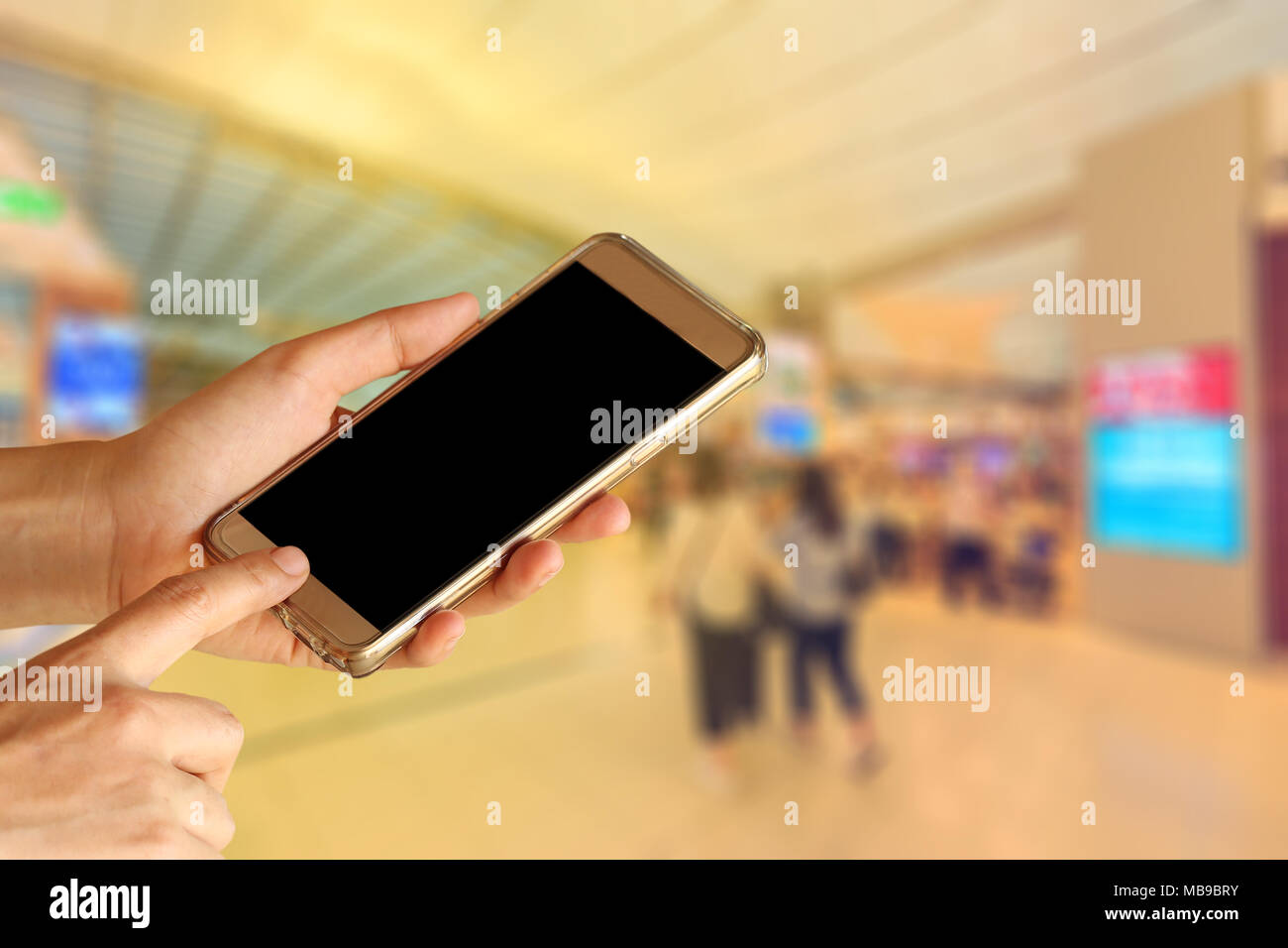 woman hand hold and touch screen smart phone, tablet,cell phone over ...