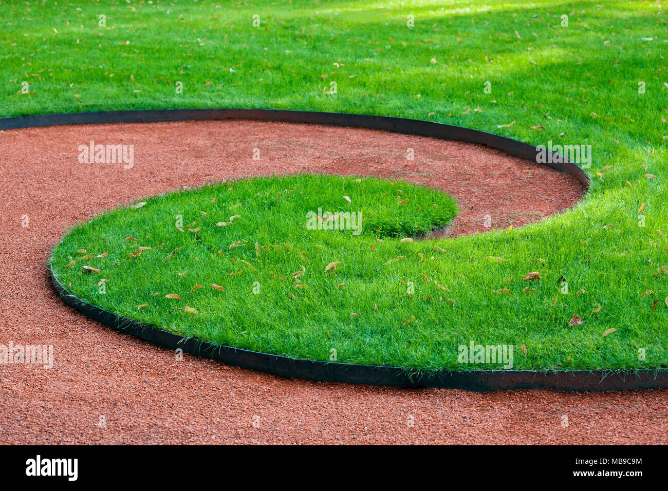 Decorative lawn in a park, abstract shape Stock Photo - Alamy