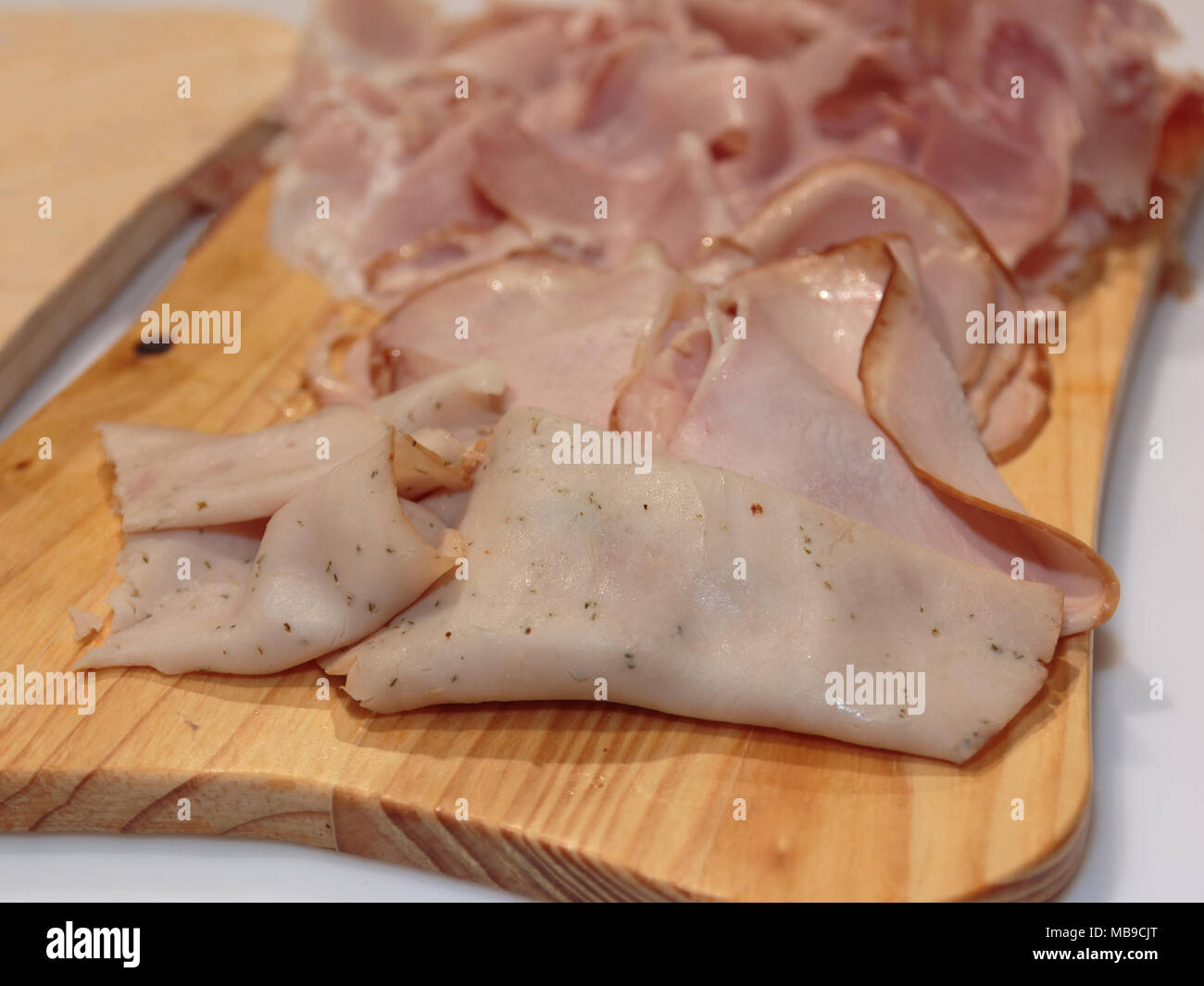 Ready-sliced Ham Steak and Seasoned Cold Cuts on Wooden Board Stock ...