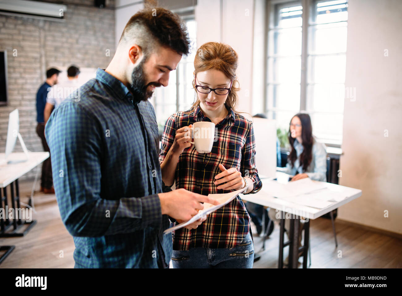 Creative team having brainstorming meeting hi-res stock photography and ...