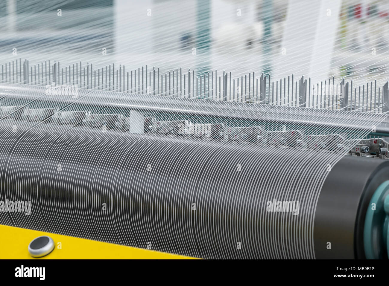 macro shooting of cotton thread twisting on the shaft. machinery and ...