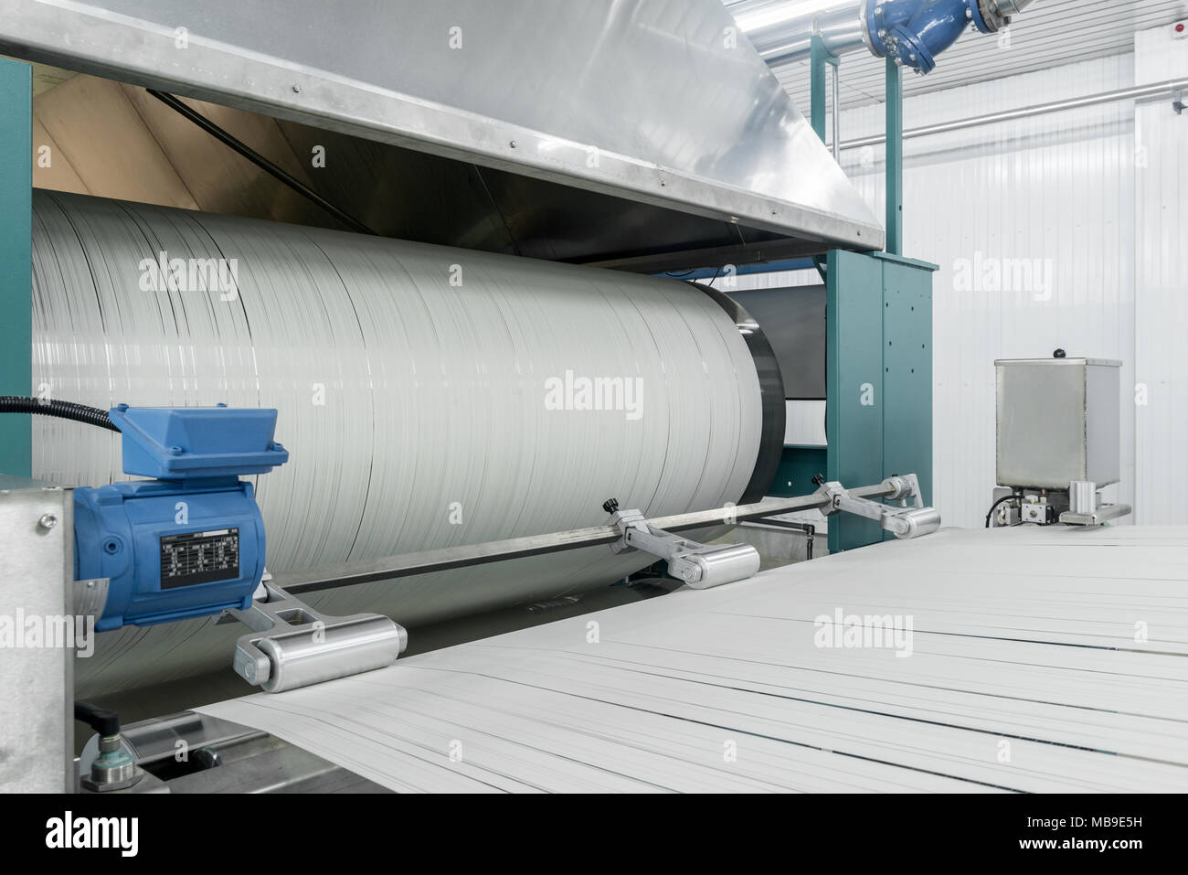 macro shooting of cotton thread twisting on the shaft. machinery and ...