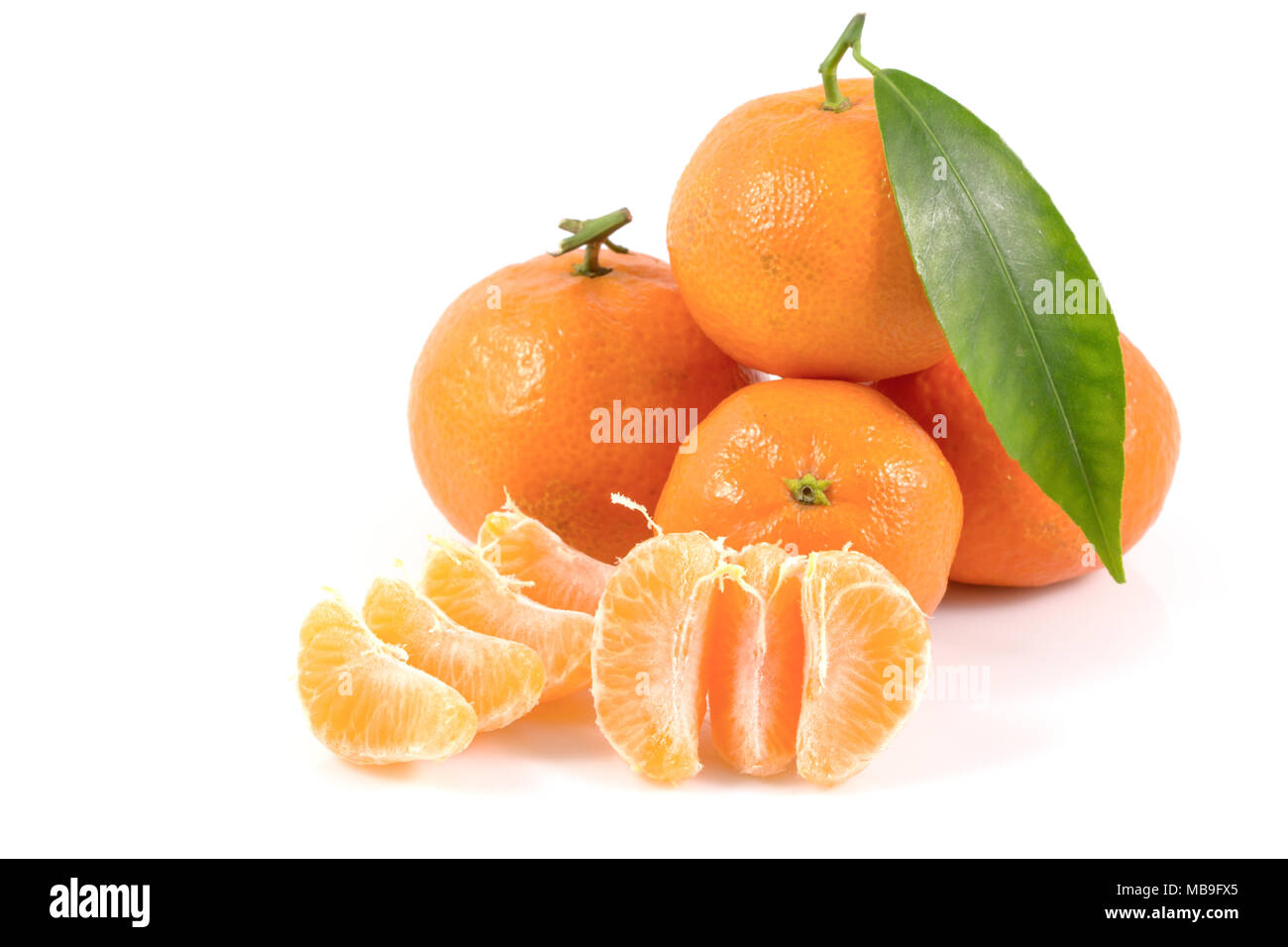 Fresh tangerines oranges with leaves isolated on white background ...