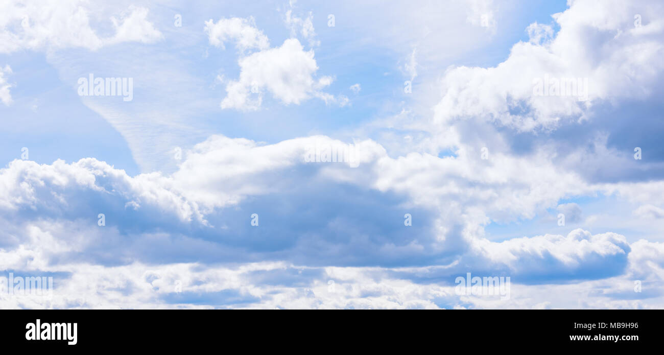 Sunny blue sky background with clouds Stock Photo - Alamy