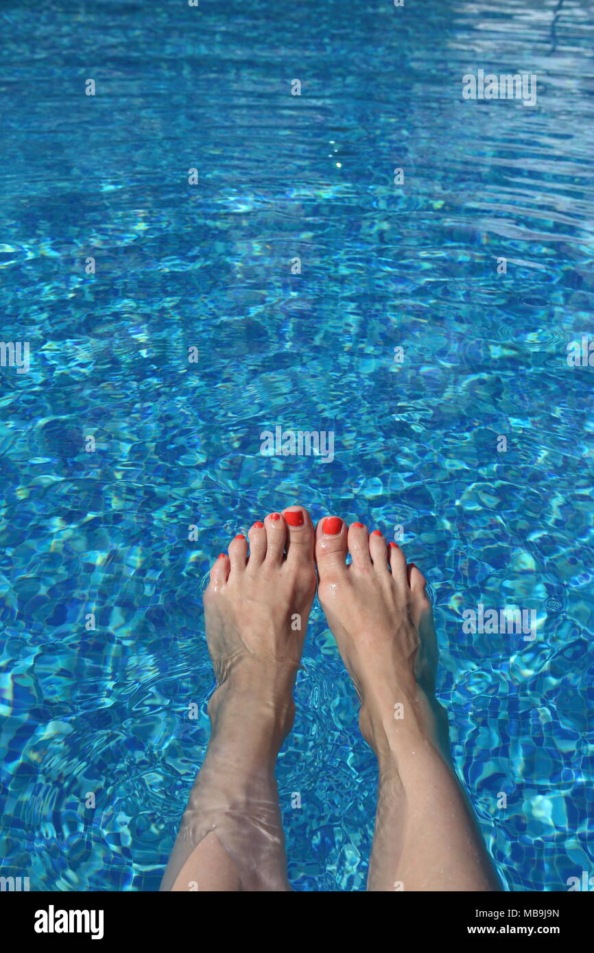 Woman legs sun pool relax hi-res stock photography and images - Alamy