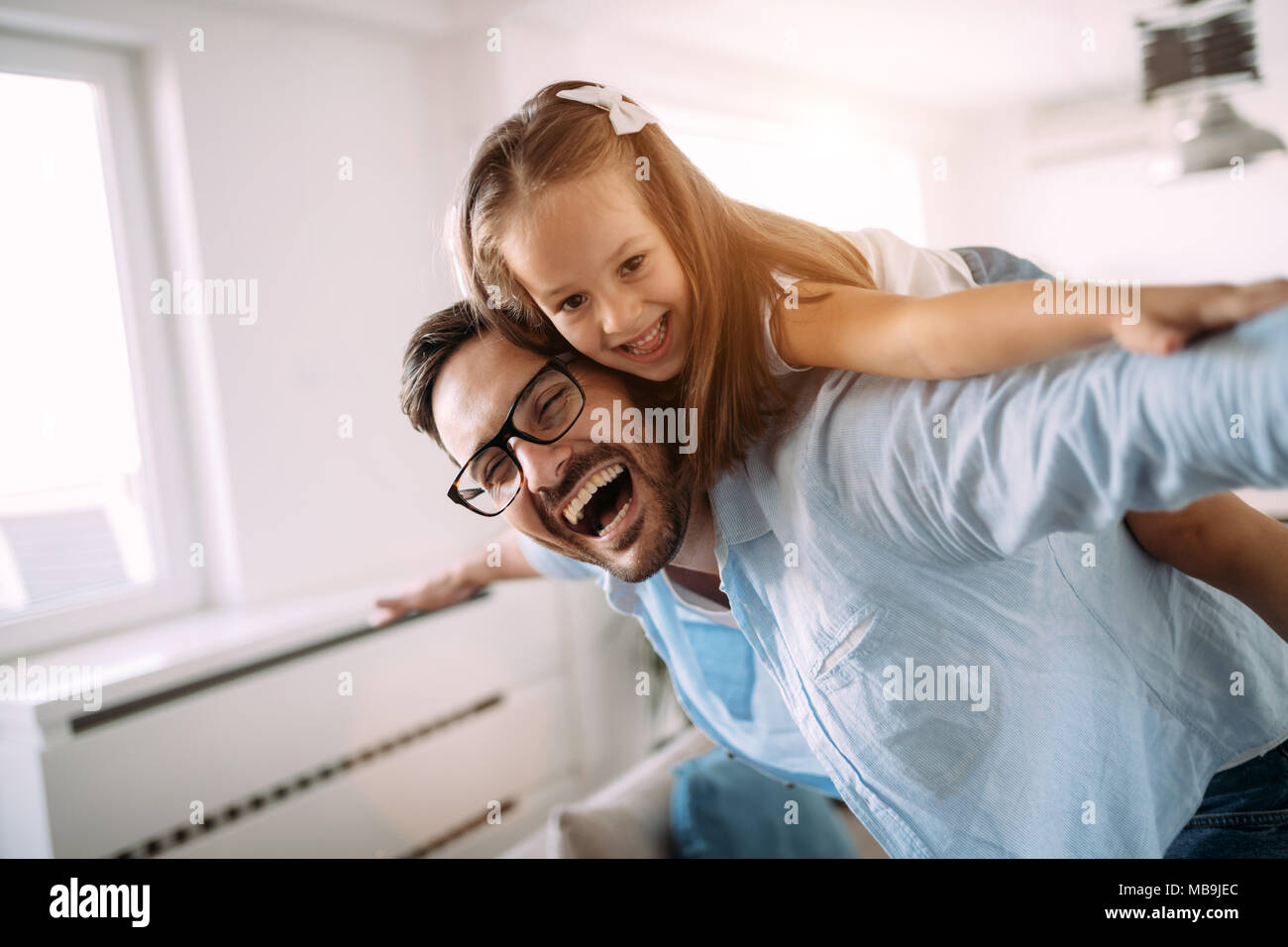 Happy family having fun time at home Stock Photo - Alamy