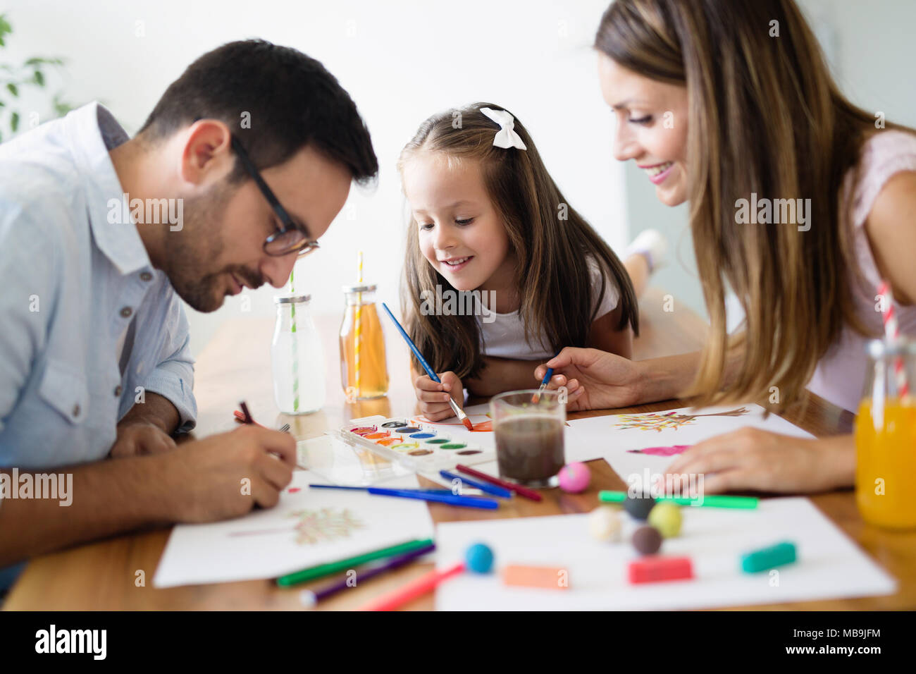 Happy family having fun time at home Stock Photo - Alamy