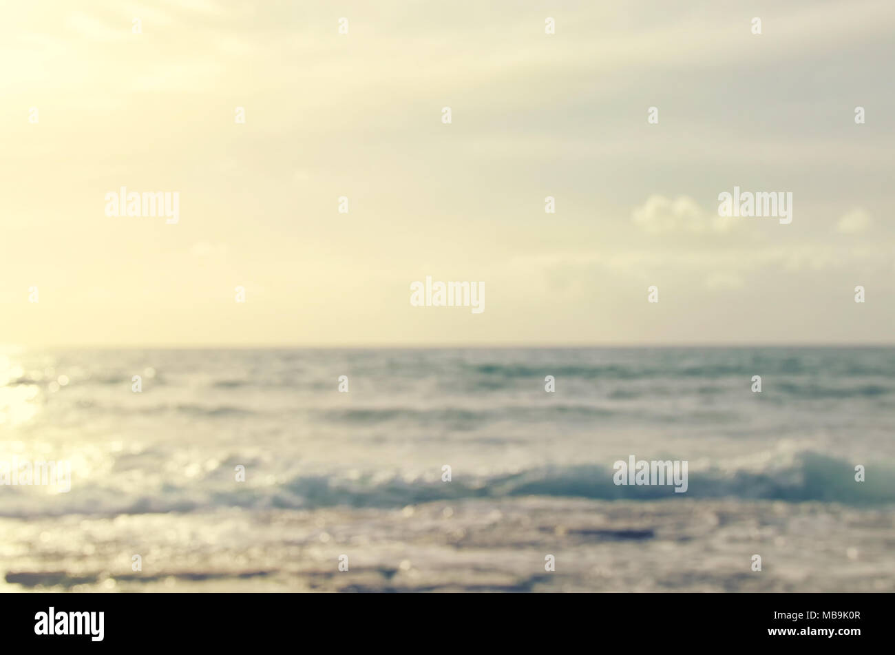 background of blurred beach and sea waves with bokeh sunset light Stock ...