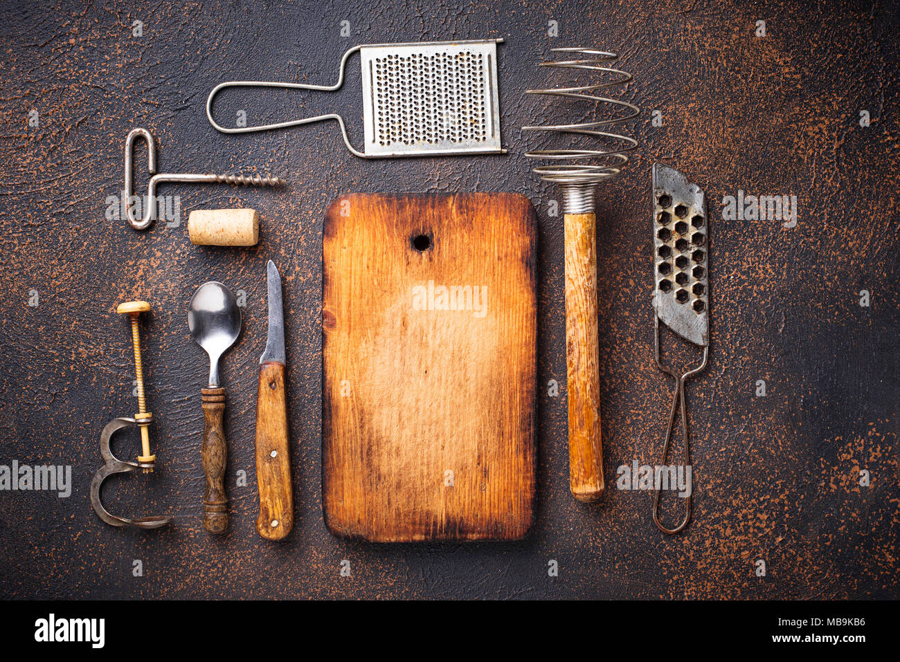Old vintage kitchen utensils on rusty background Stock Photo - Alamy