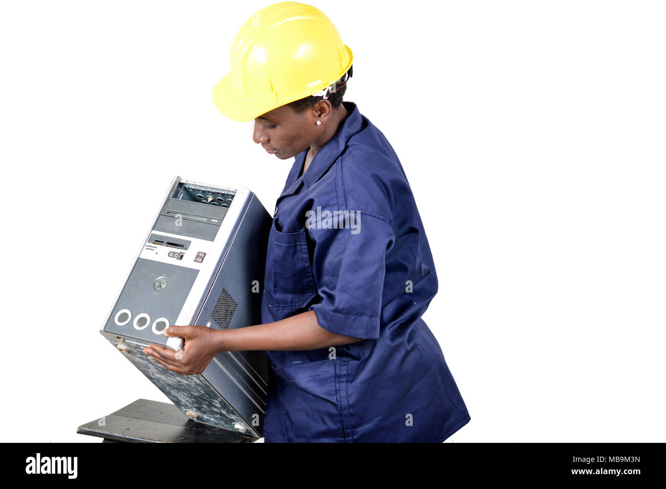 Young female computer repairer checks a central unit by lifting it ...