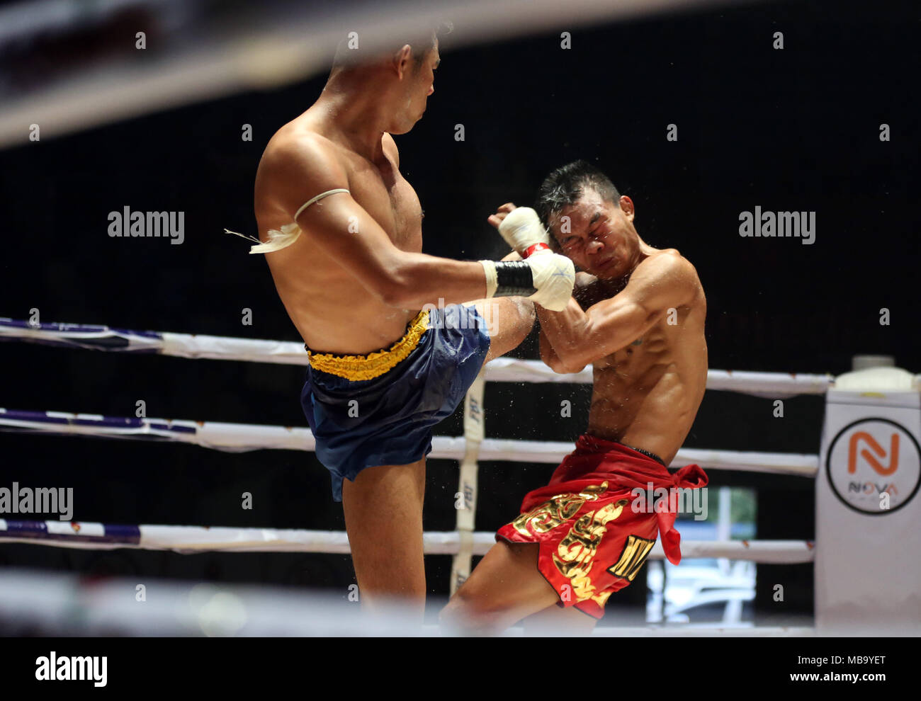 Yangon, Myanmar. 8th Apr, 2018. Soe Lin Oo (R) of Myanmar fights with ...