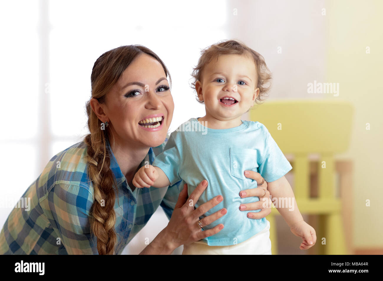 Mom and baby sharing a happy moment in their home Stock Photo - Alamy
