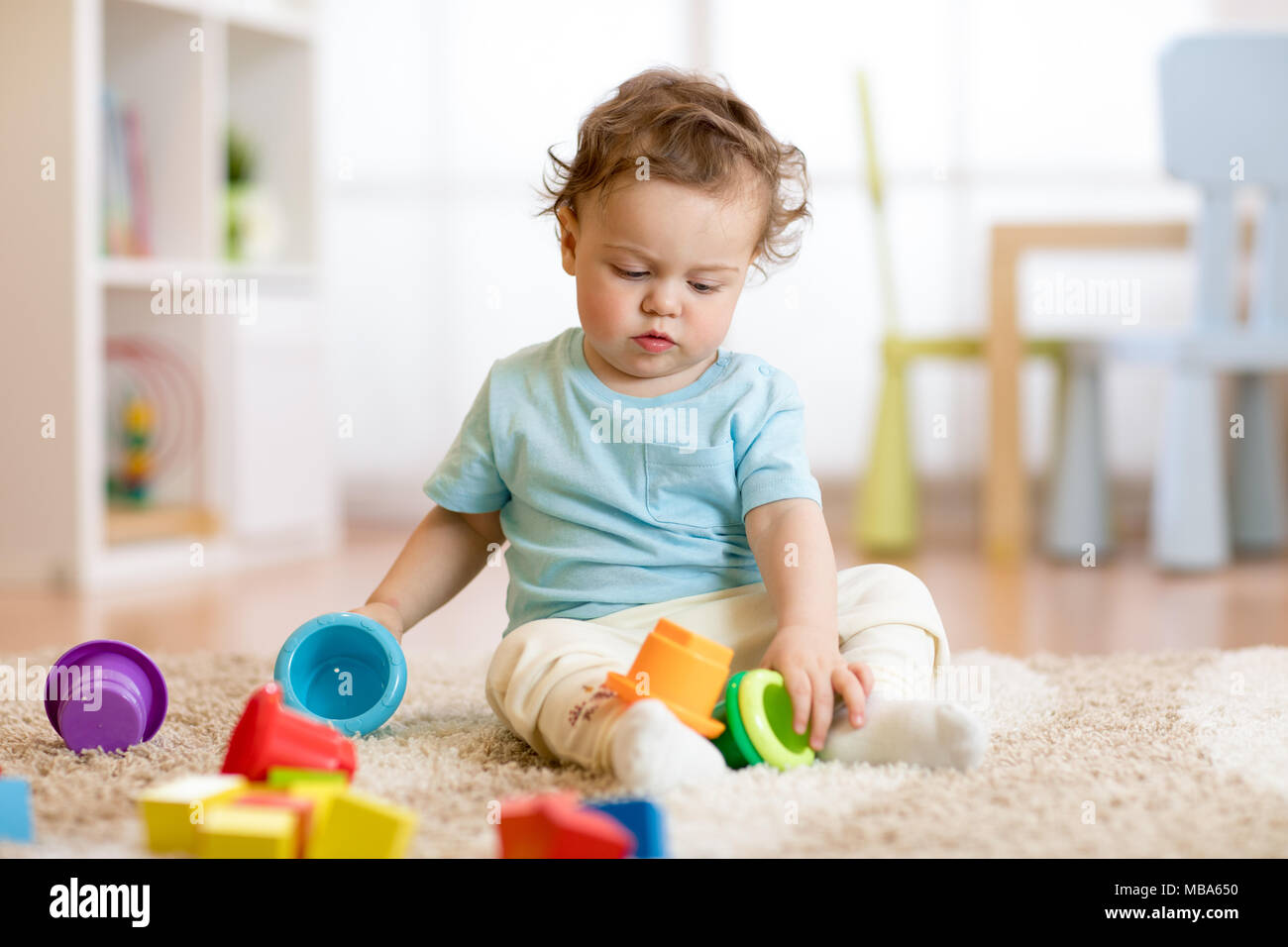 baby toddler playing toys at home or nursery Stock Photo - Alamy