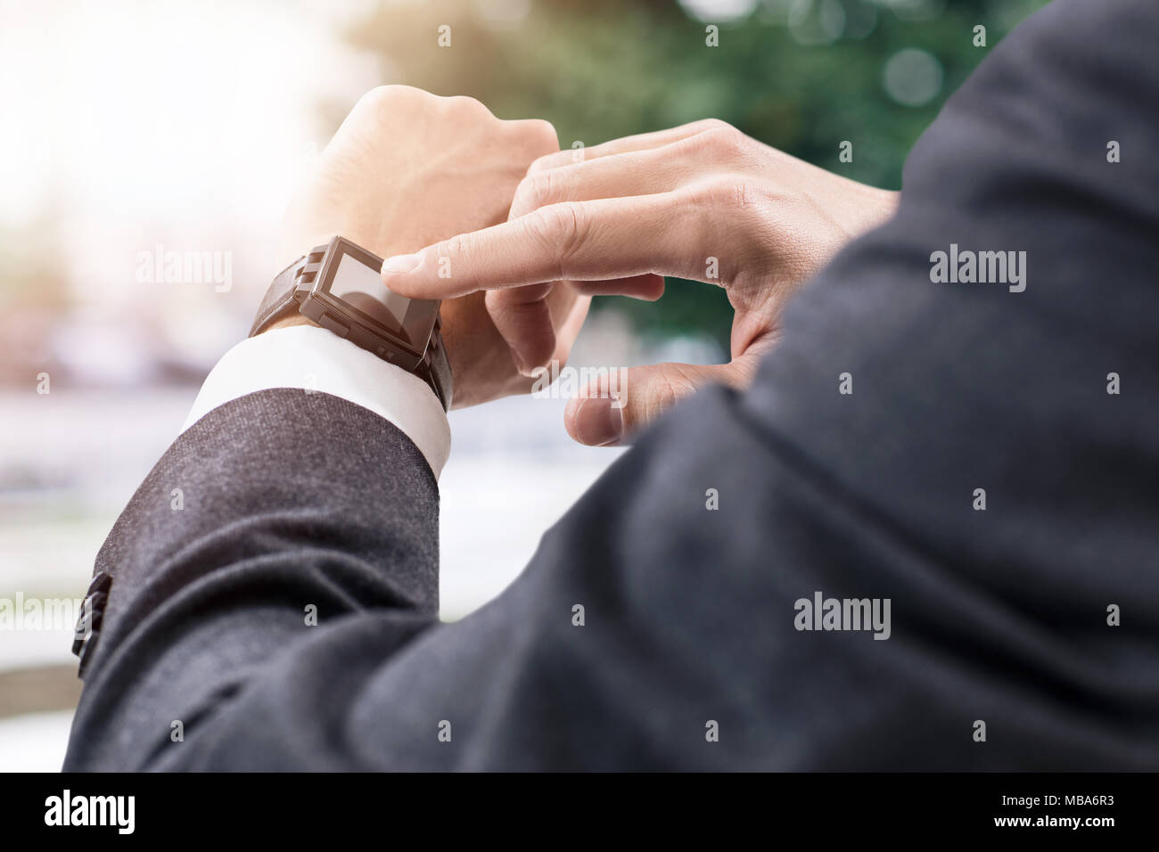 Closeup hands of man using his smartwatch Stock Photo - Alamy