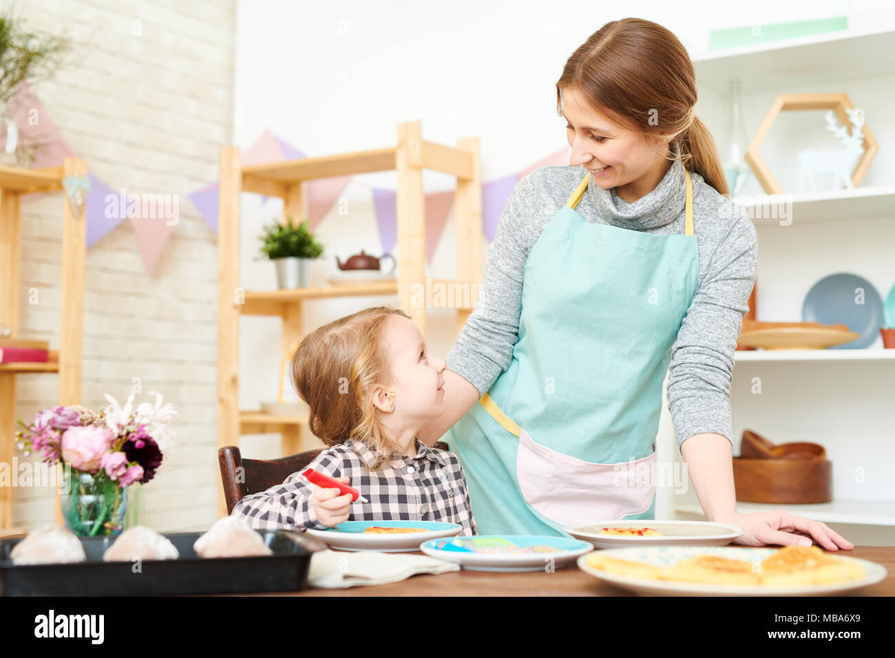 Decorating Homemade Waffles with Mom Stock Photo - Alamy