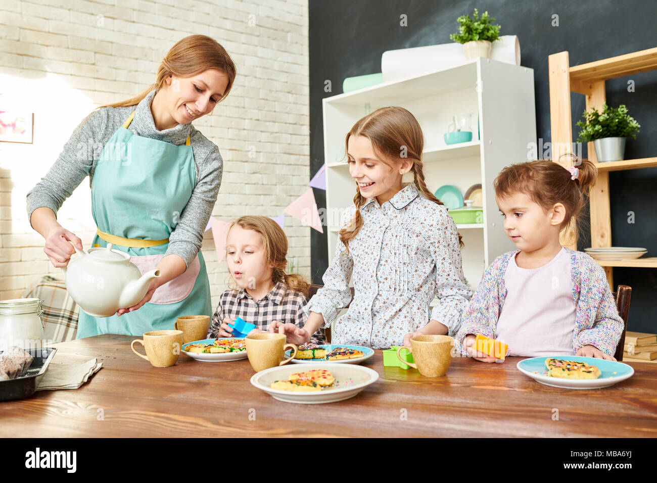 Kids having tea hi-res stock photography and images - Alamy