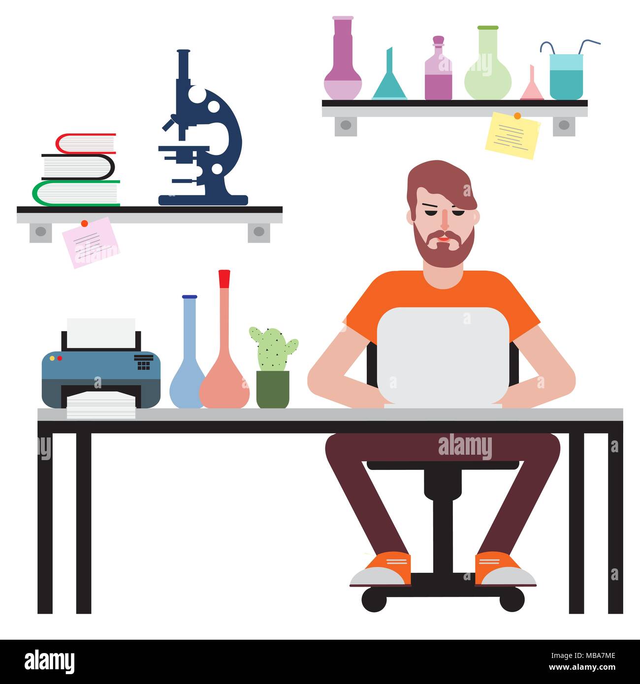 Scientist. Man sitting at table in his office and working on laptop ...