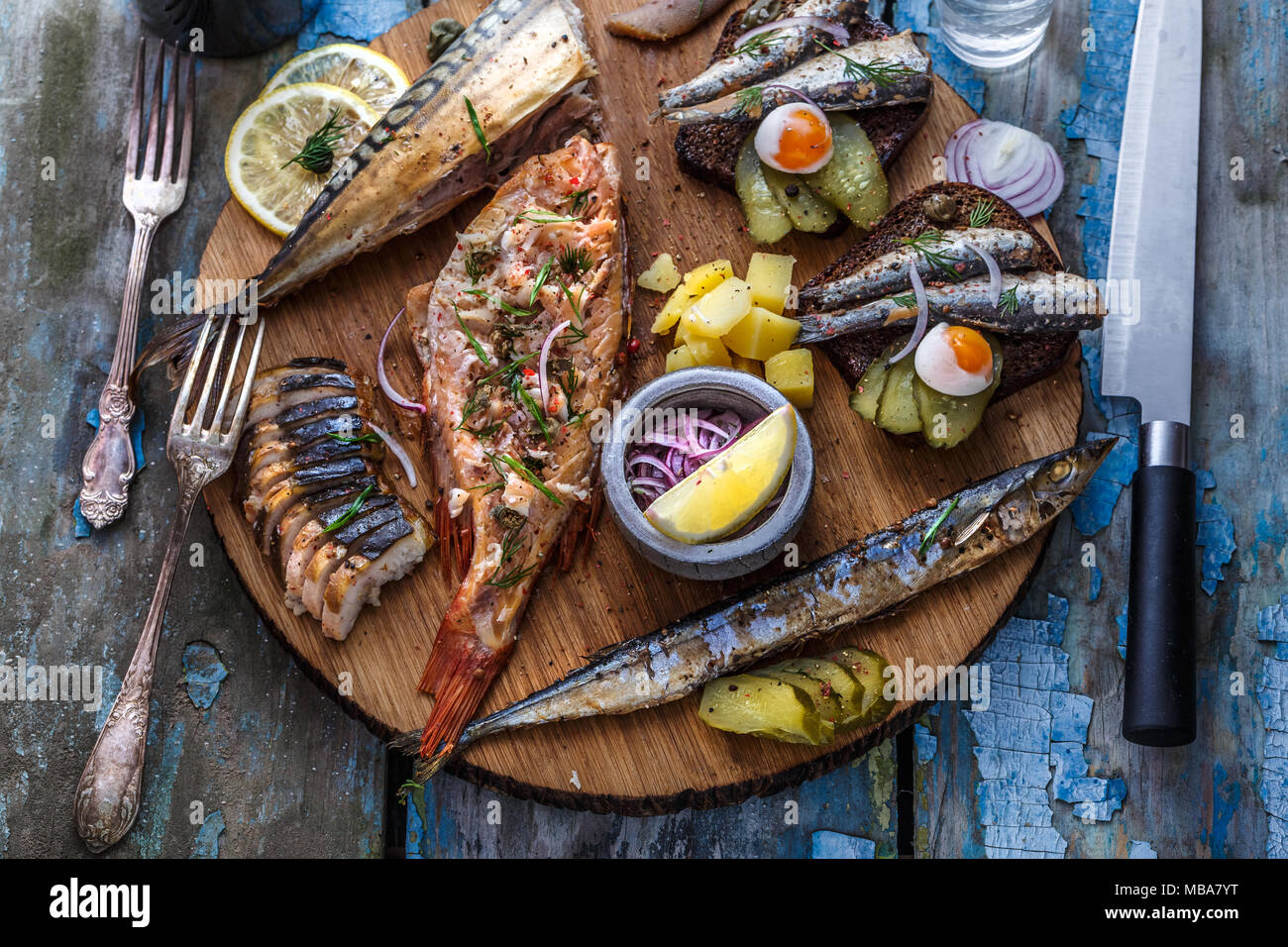 Fish plate with sturgeon, trout, perch, mackerel. Assorted fish on a ...