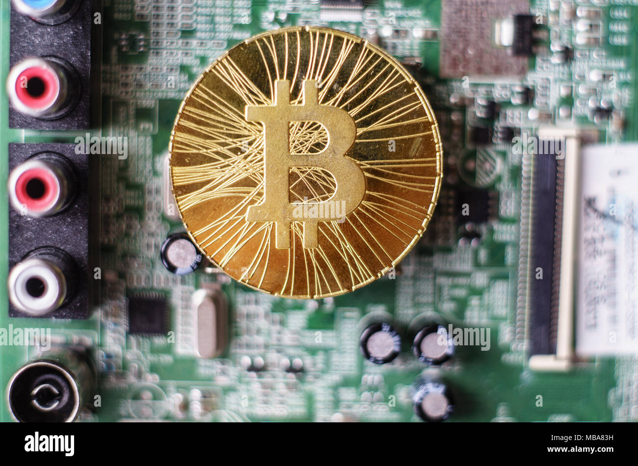 Gold souvenir coin Bitcoin on a computer circuit board background Stock ...