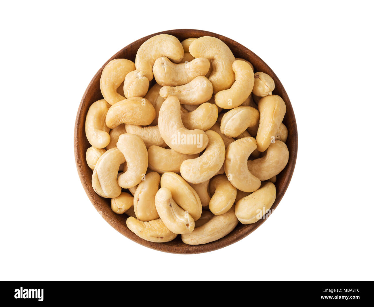 Raw cashew nut in wooden bowl isolated on white background top view ...