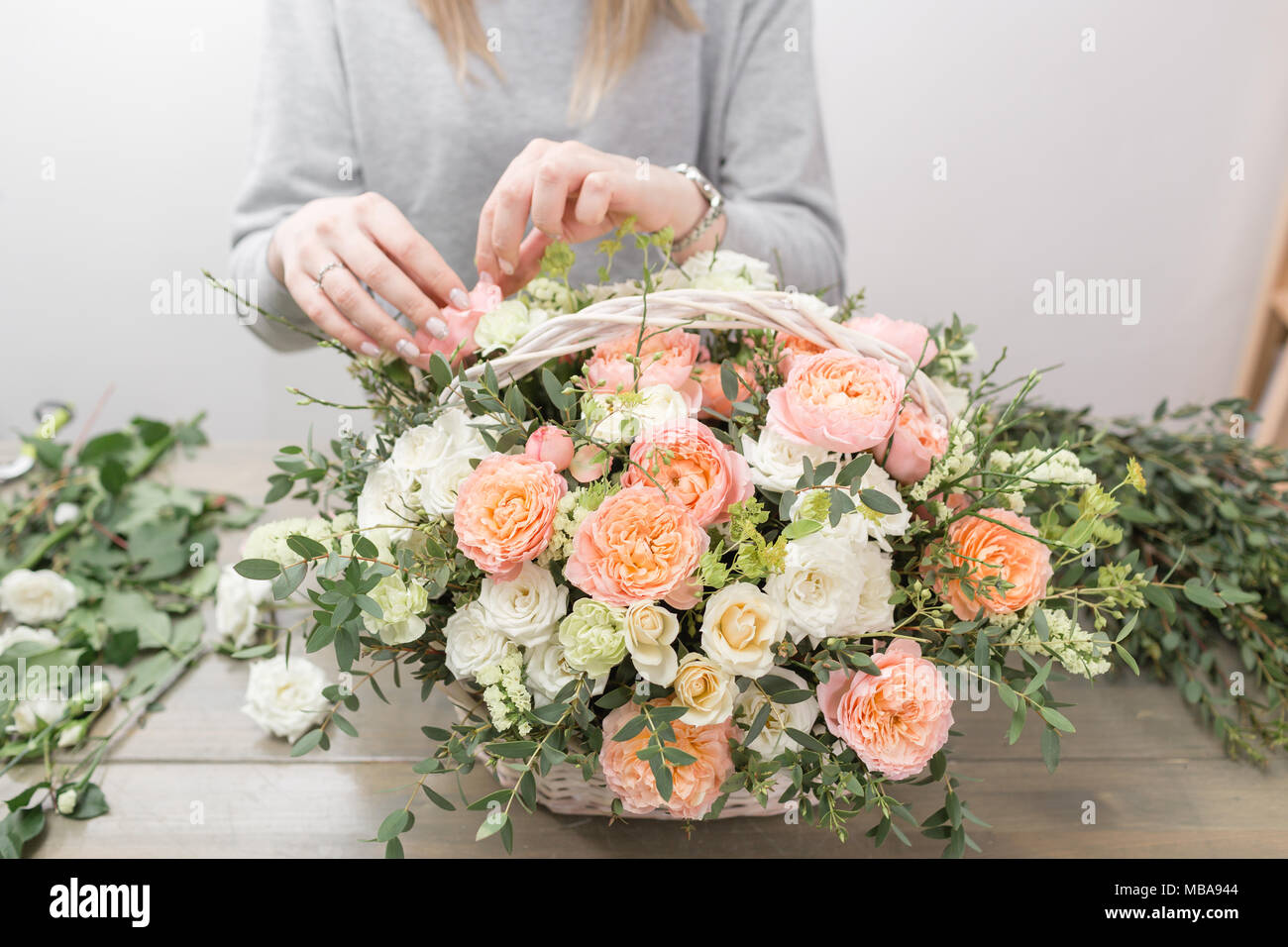 close-up hands female florist. Floral workshop - woman making a ...