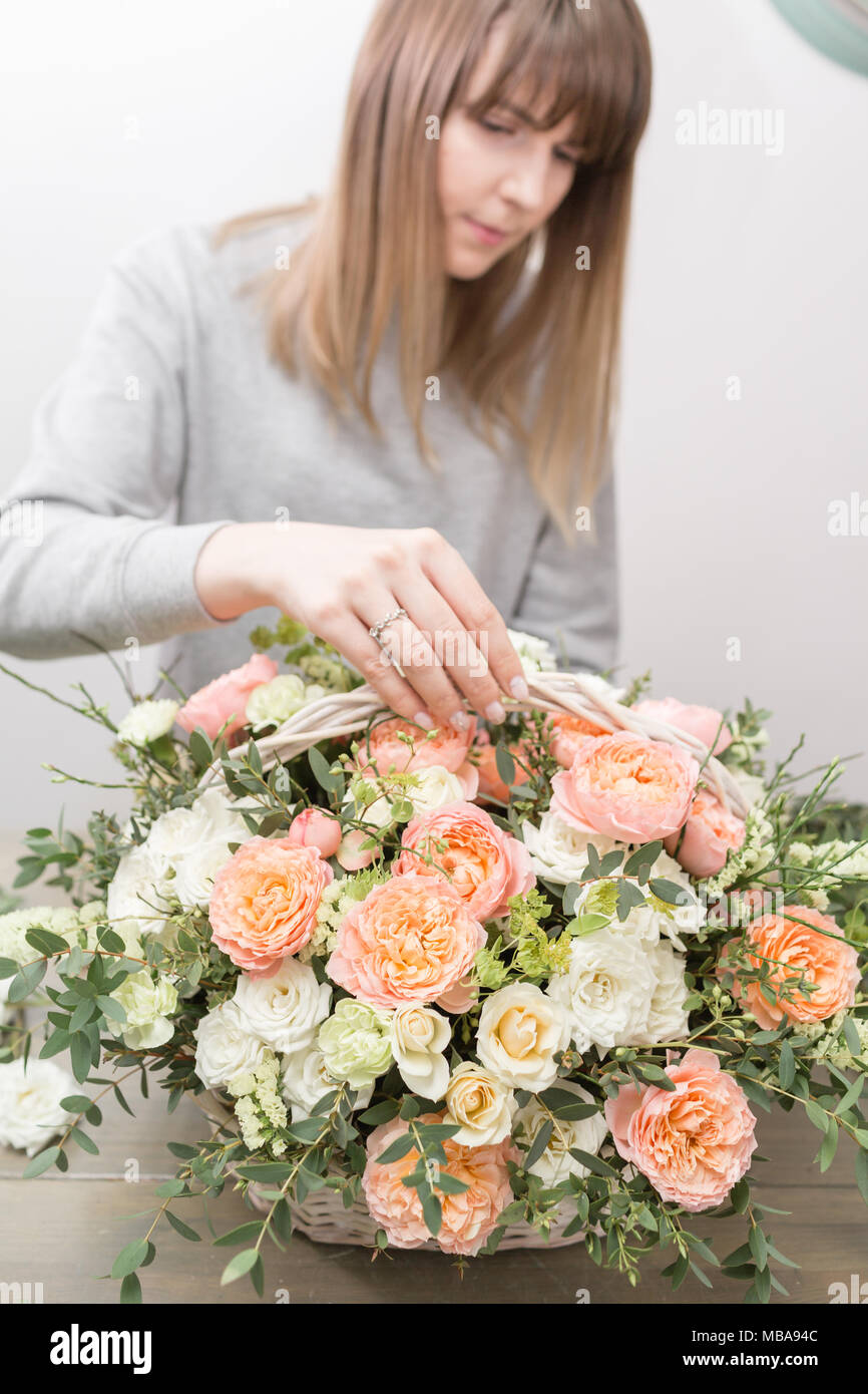 close-up hands female florist. Floral workshop - woman making a ...