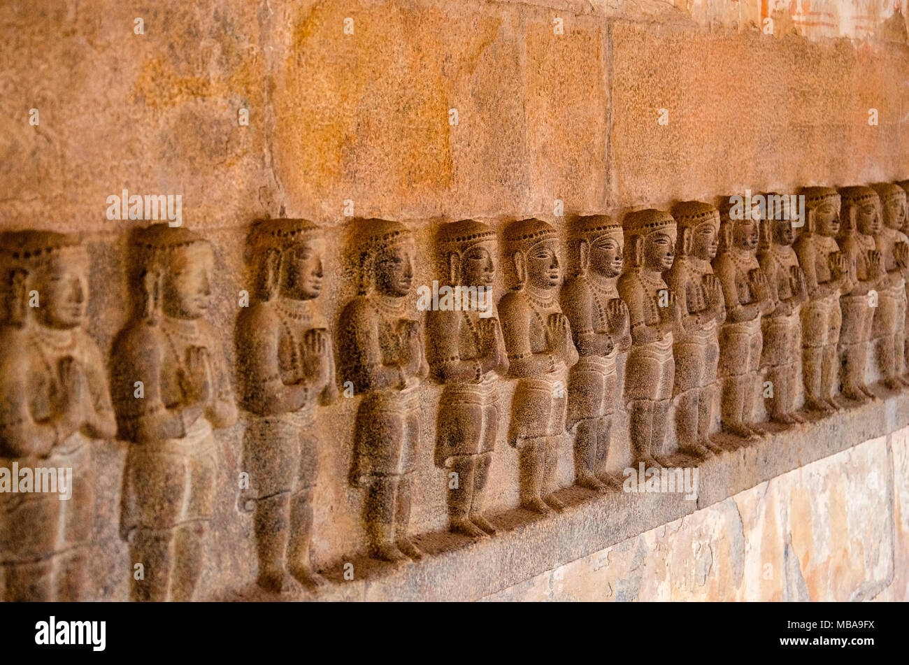 Carving idols on the inner wall of Airavatesvara Temple, Darasuram ...