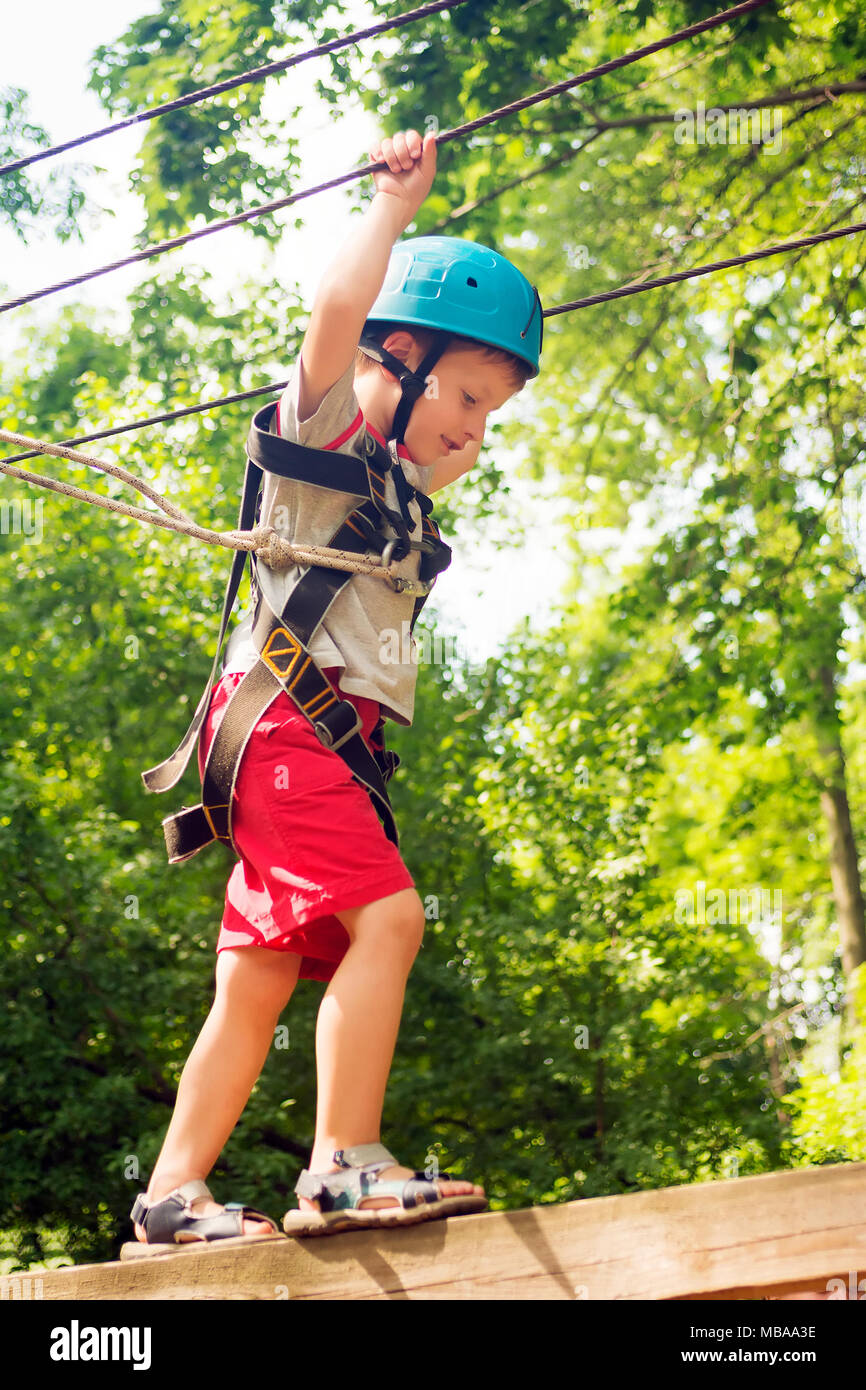 Boy balance rope bridge hi-res stock photography and images - Alamy