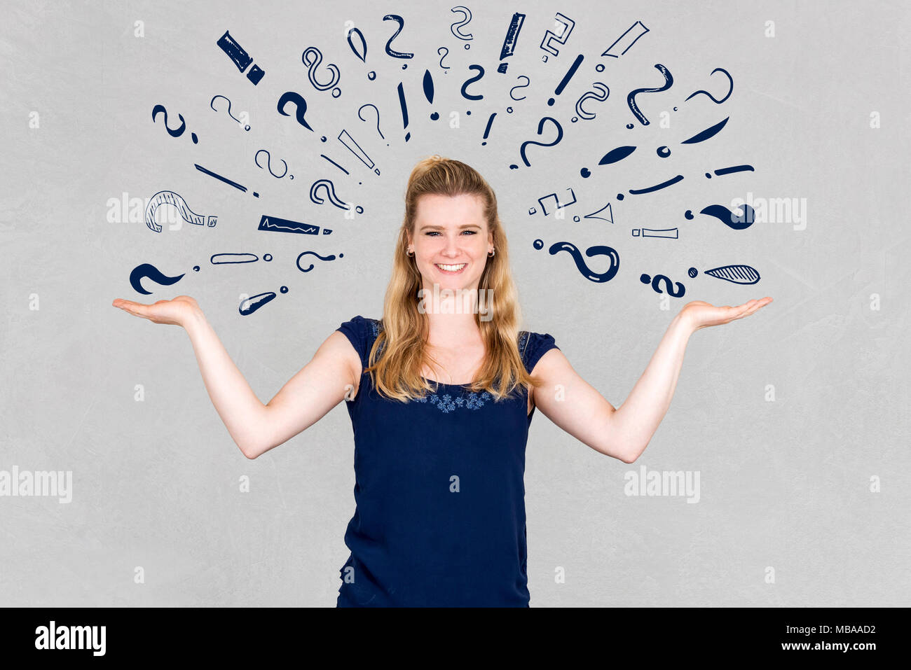 Happy attractive woman holding hands up with exclamation and question ...