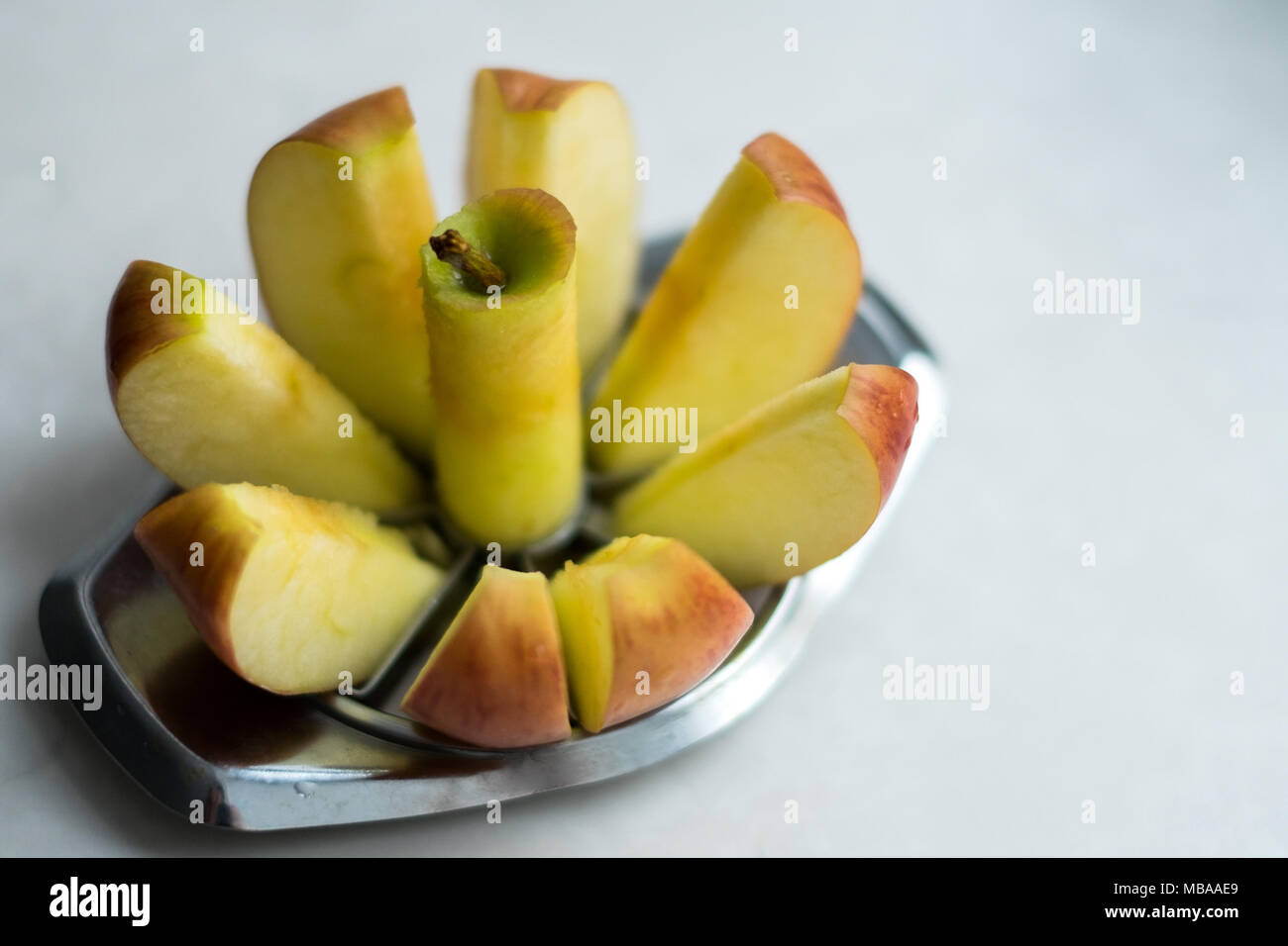 Image of red apple cut into pieces Stock Photo - Alamy