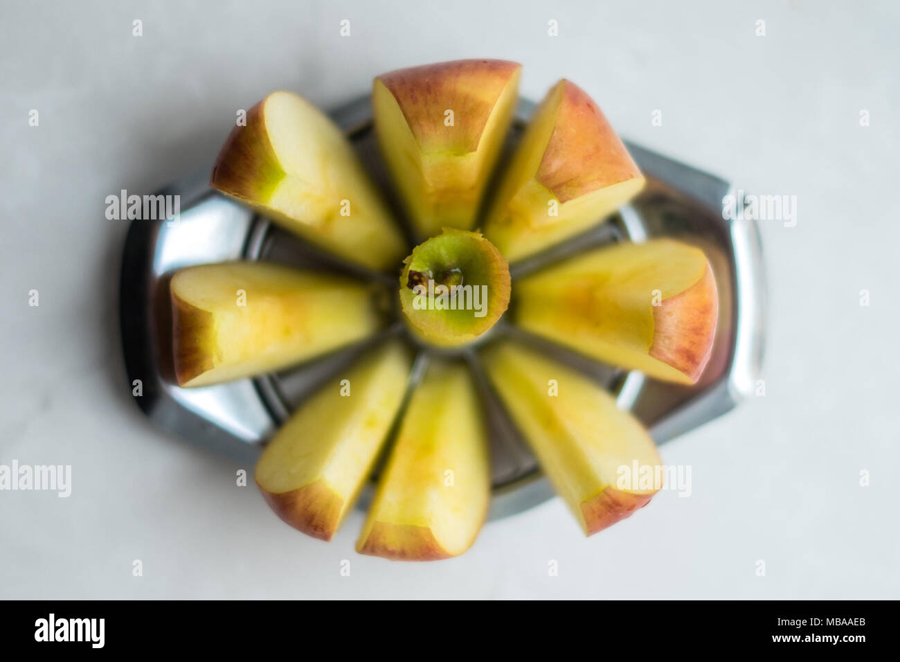 Picture of red apple cut into pieces Stock Photo - Alamy